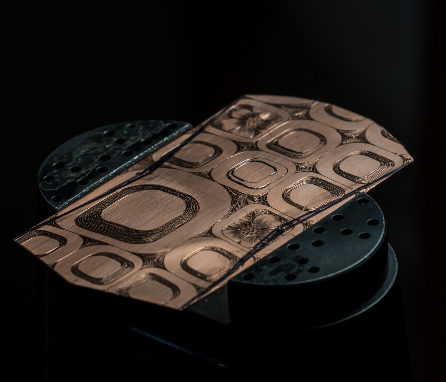 The image shown is a close up of the Tlingit formline ovoid design that ...